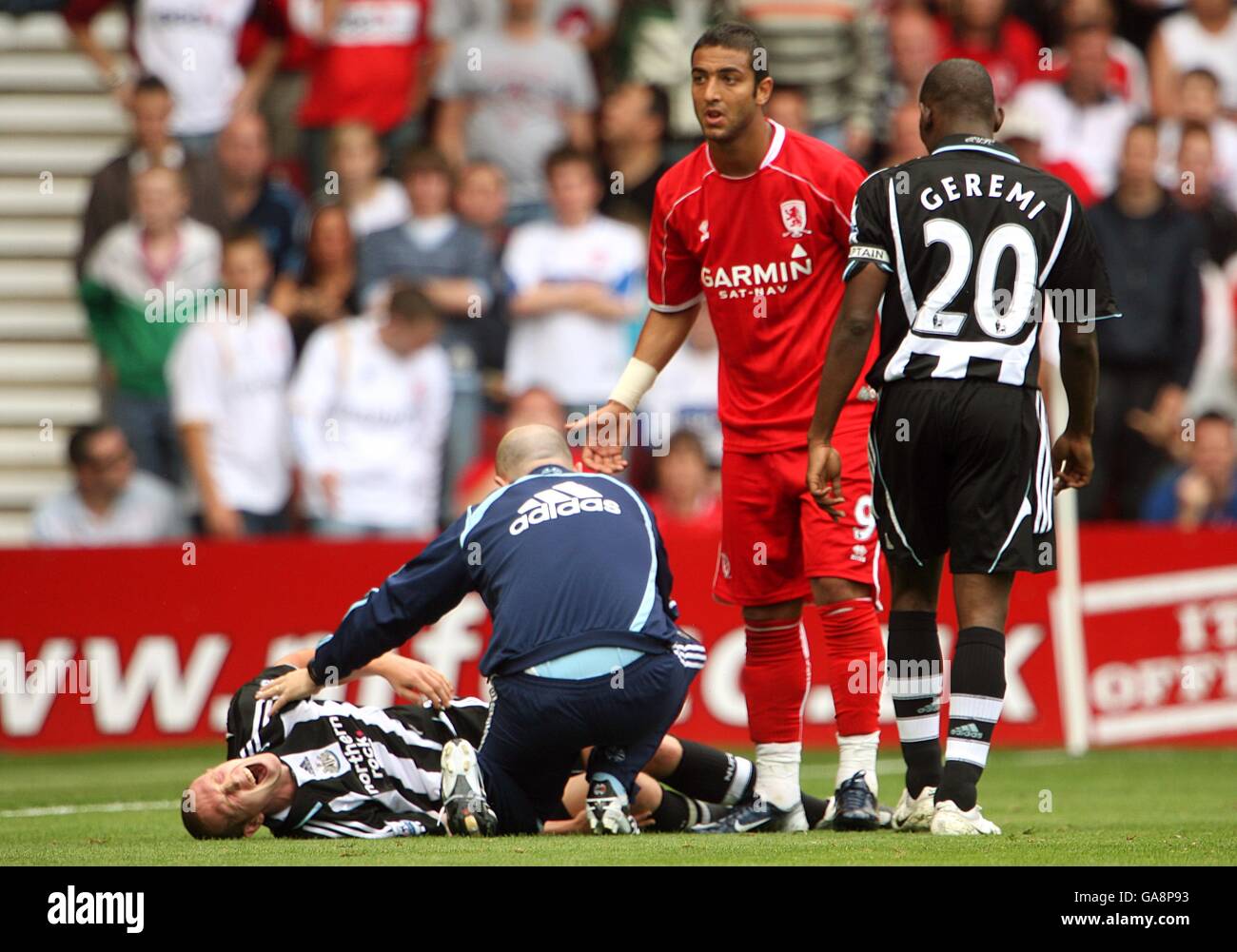 Newcastle United's Peter Ramage writhes around in pain on the ground ...