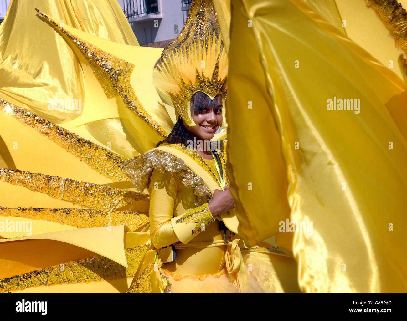 Carnival revellers join the procession of junior entrants in the ...