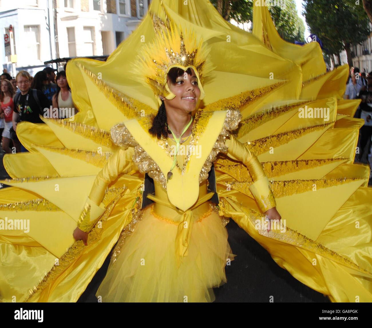 Carnival revellers join the procession of junior entrants in the ...