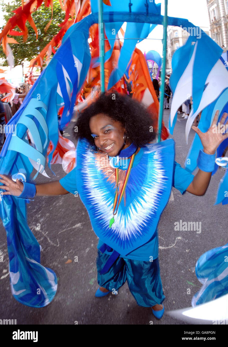 Carnival revellers join the procession of junior entrants in the ...