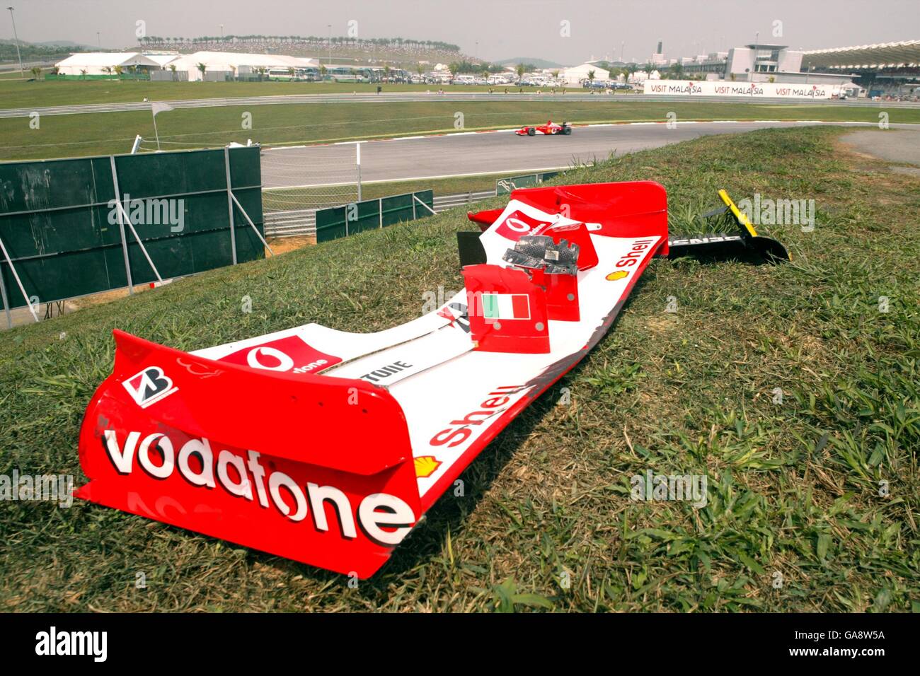 Ferraris michael schumacher drives past his snapped off front wing hi ...