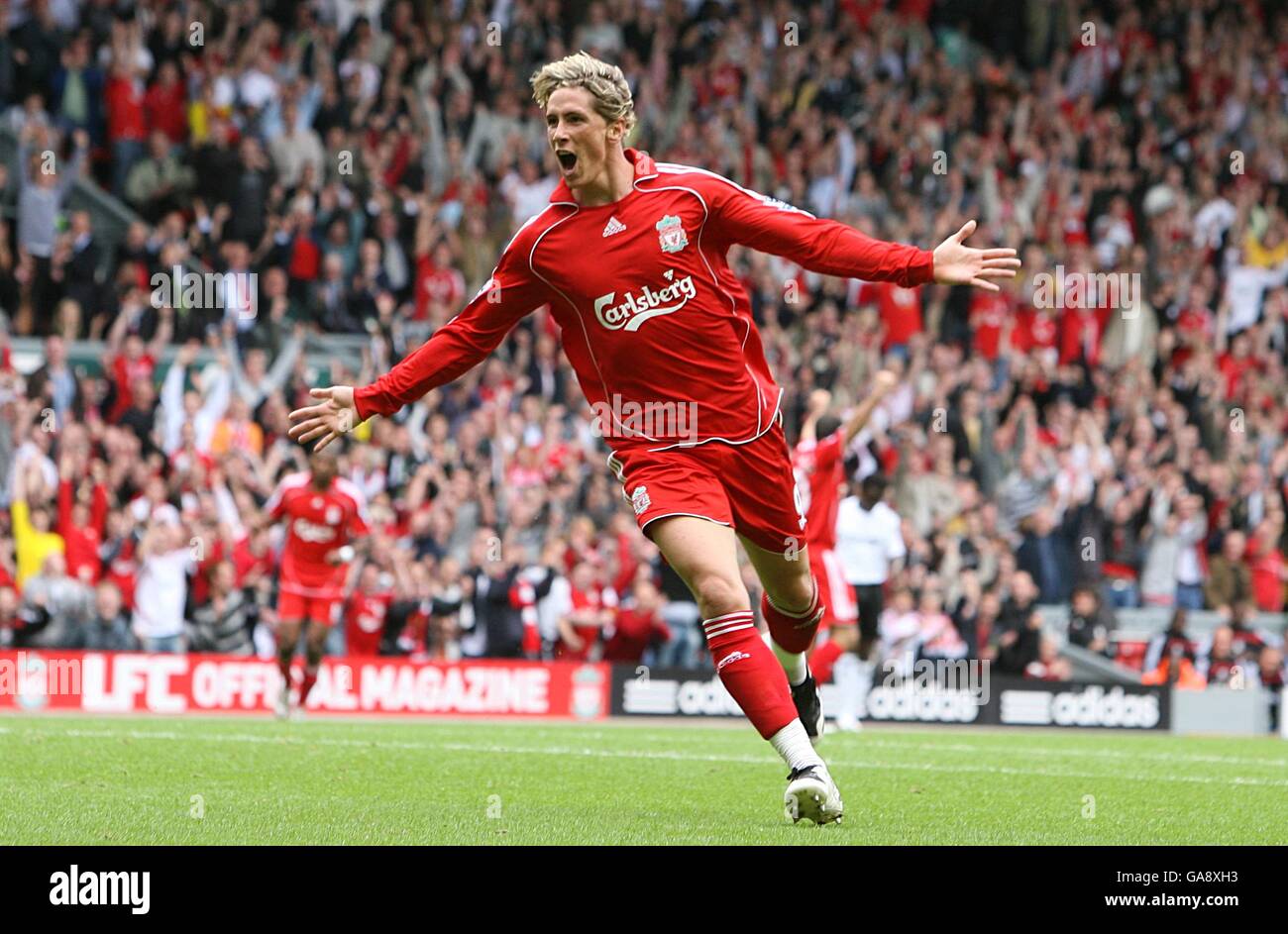 Liverpool's Fernando Torres celebrates after scoring the third goal ...