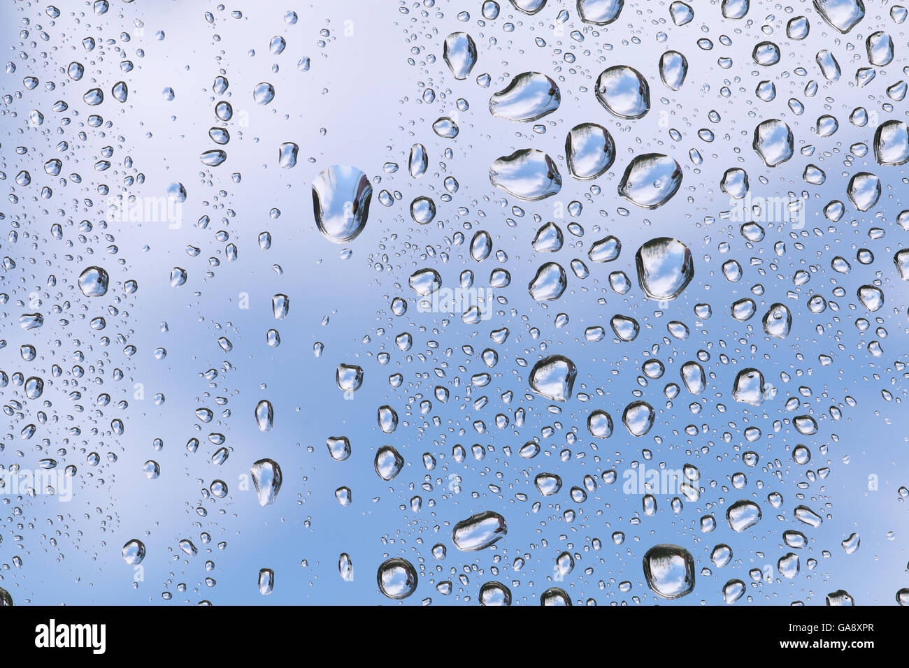 rain drop texture on blue sky background Stock Photo - Alamy