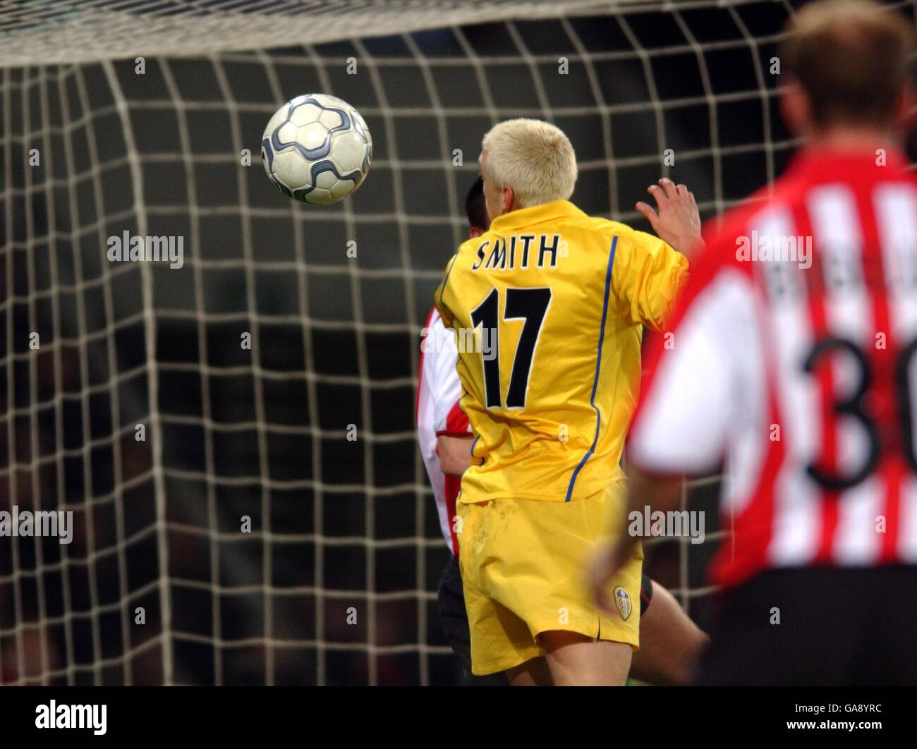 Leeds United's Alan Smith heads the ball towards the goal but his ...
