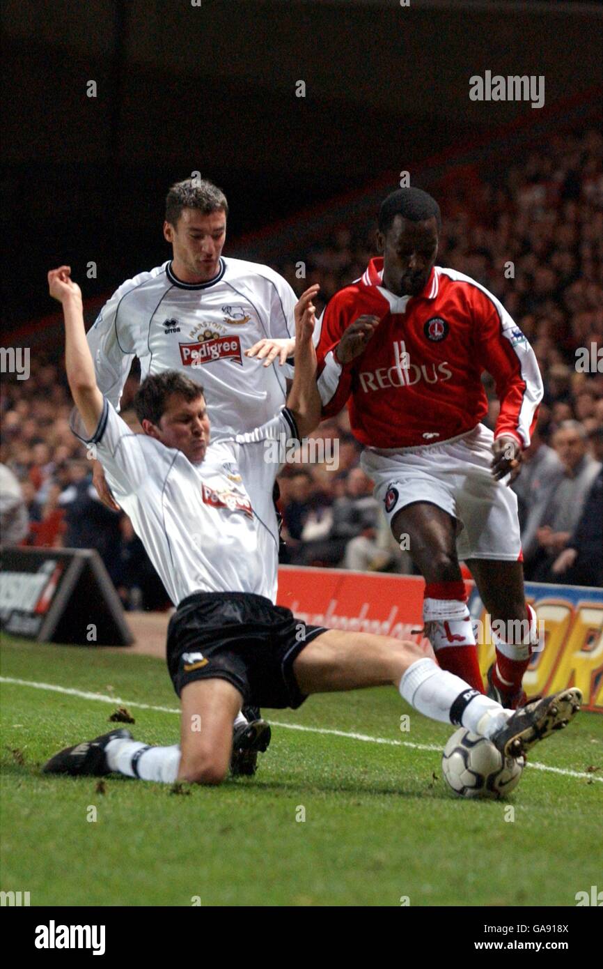 Derby County's Richard Jackson (l) slides in to tackle Charlton ...