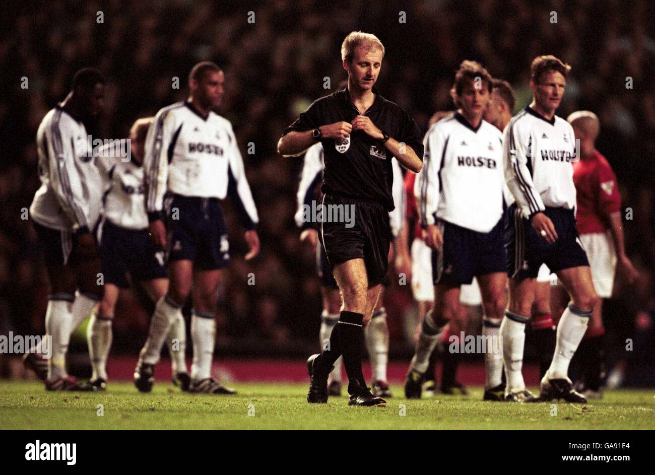 Referee Mike Riley is not very popular with the Tottenham players after ...