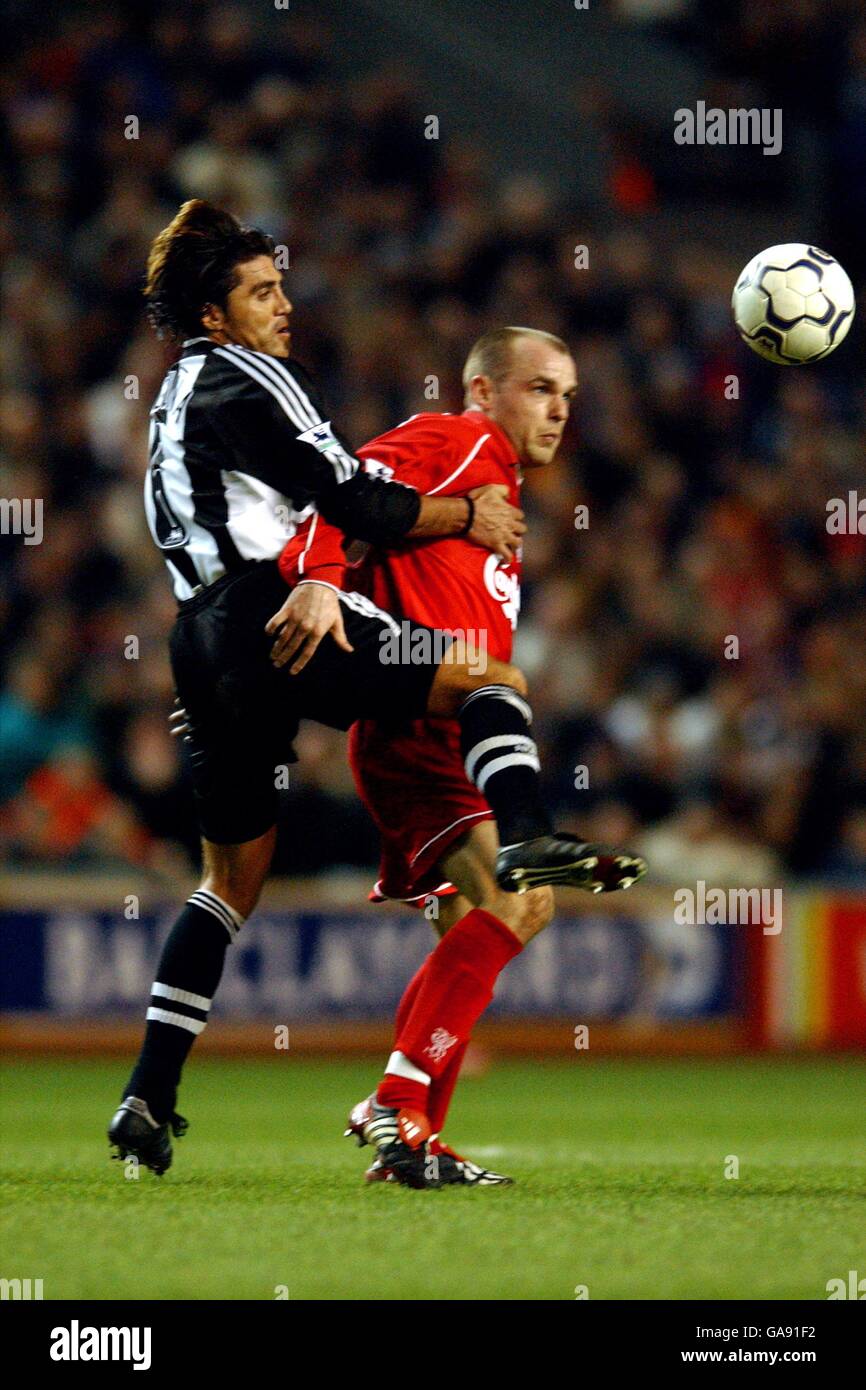 Newcastle uniteds clarence acuna holds off liverpools danny murphy hi ...