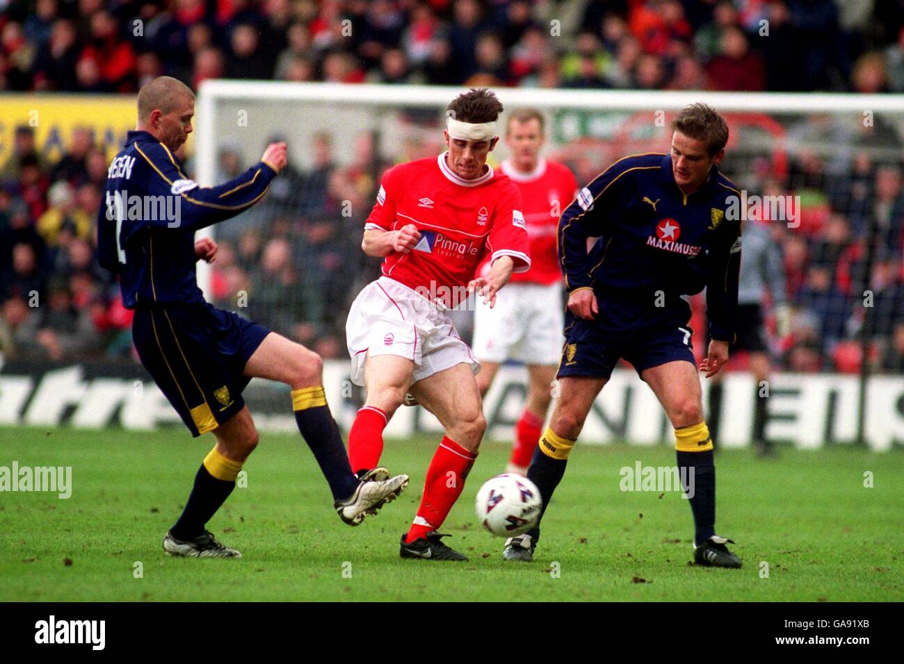 Nottingham Forest's David Prutton and Wimbledon's Trond Andersen and ...