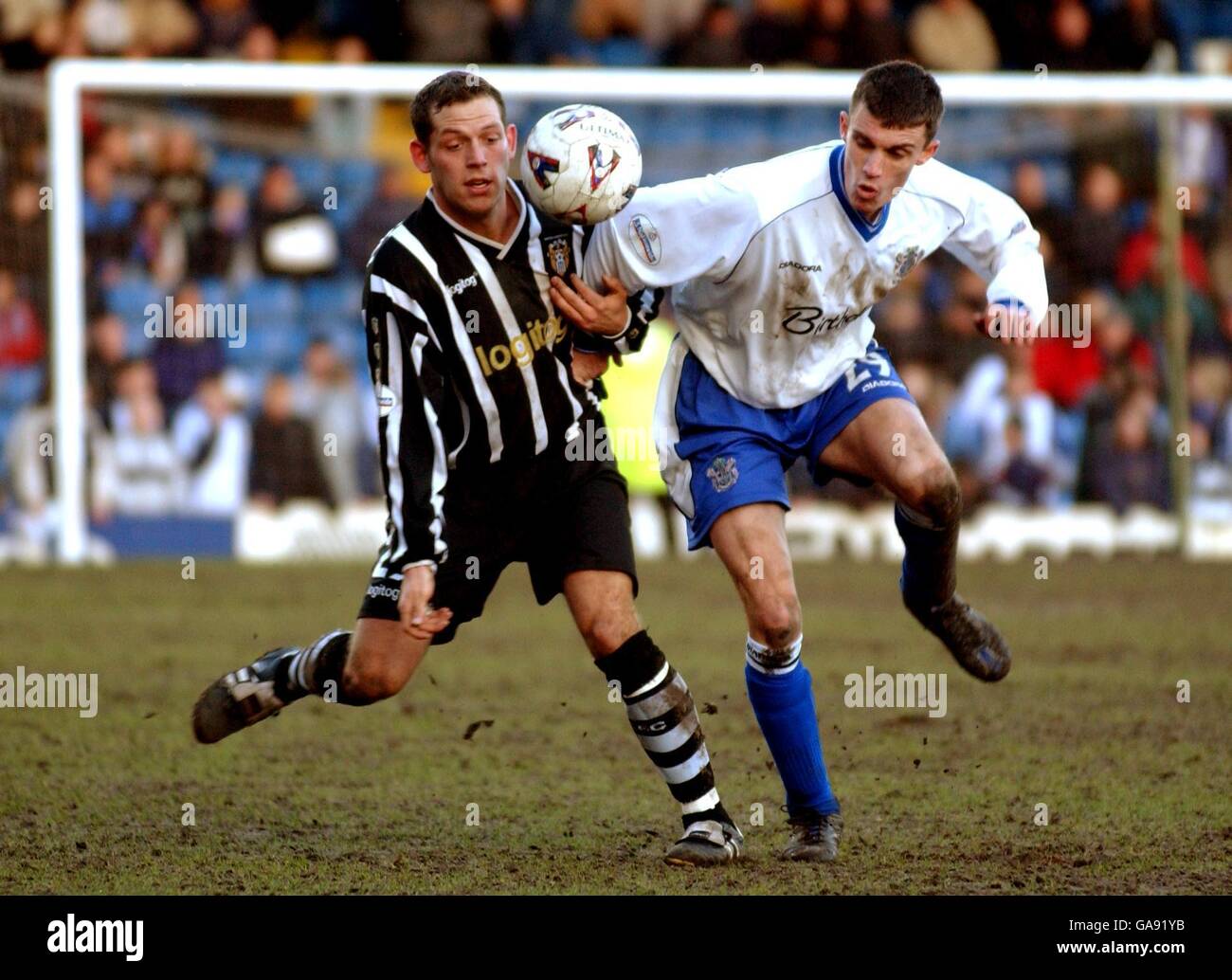 Leam Richardson of Notts County and Jon Newby of Bury battle for the ...
