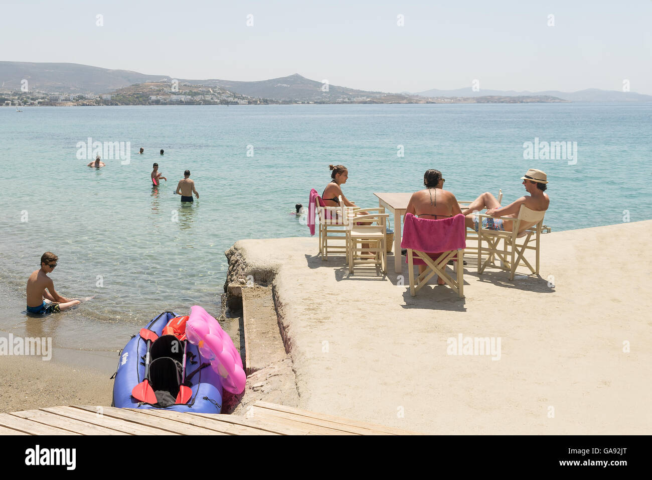 Paros, Greece, 10 August 2015. Local people and tourists enjoying their ...