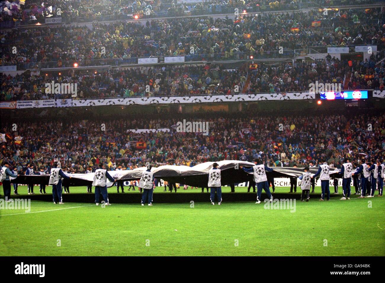 Ball boys and girls wave the uefa champions league flag hi-res stock ...