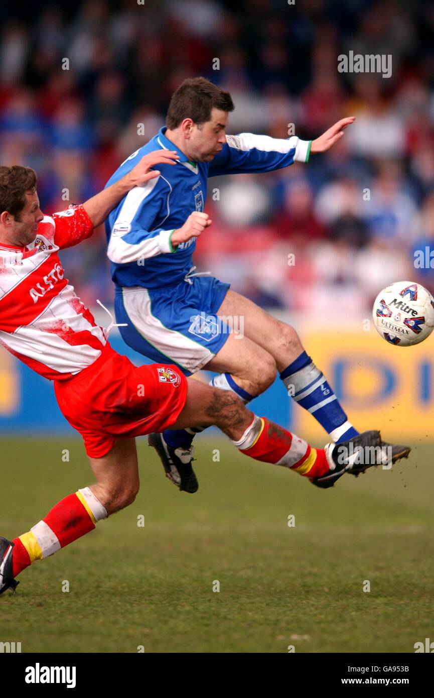 l-r; Lincoln City's Ben Sedgemore tackles Rochdale's Michael Oliver ...