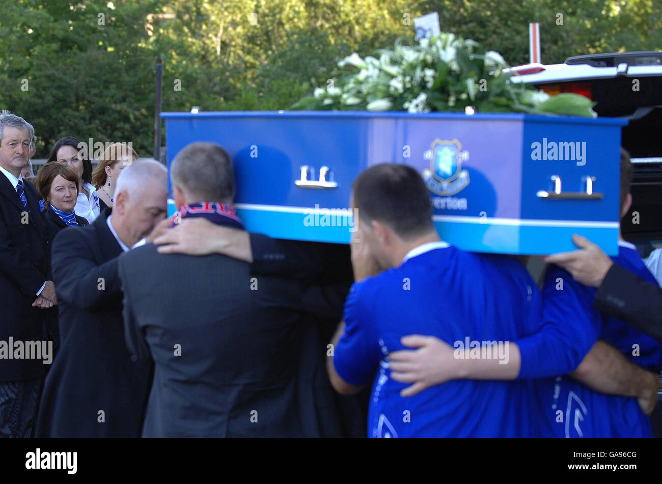 Rhys Jones' Mother Melanie (second left), watches her sons coffin ...