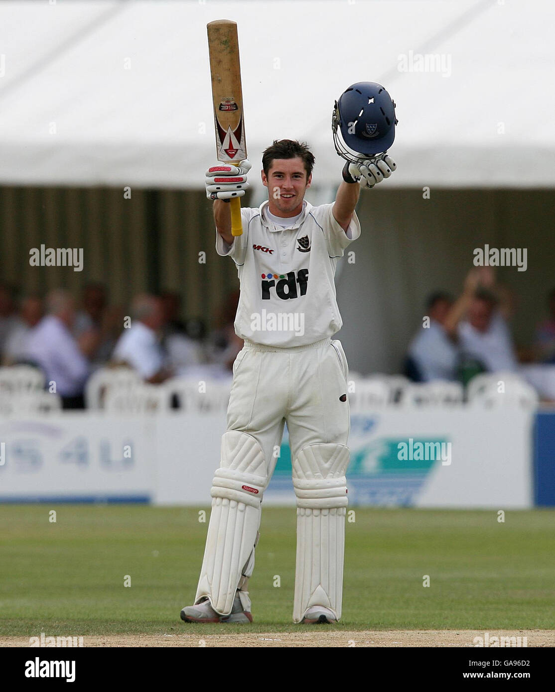 Cricket batsman raising bat hi-res stock photography and images - Alamy