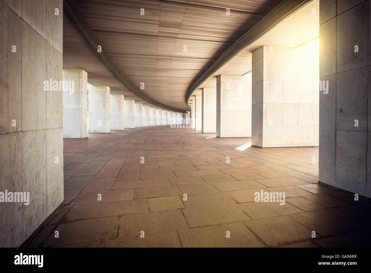 Long wide corridor of the building with columns at evening time Stock ...