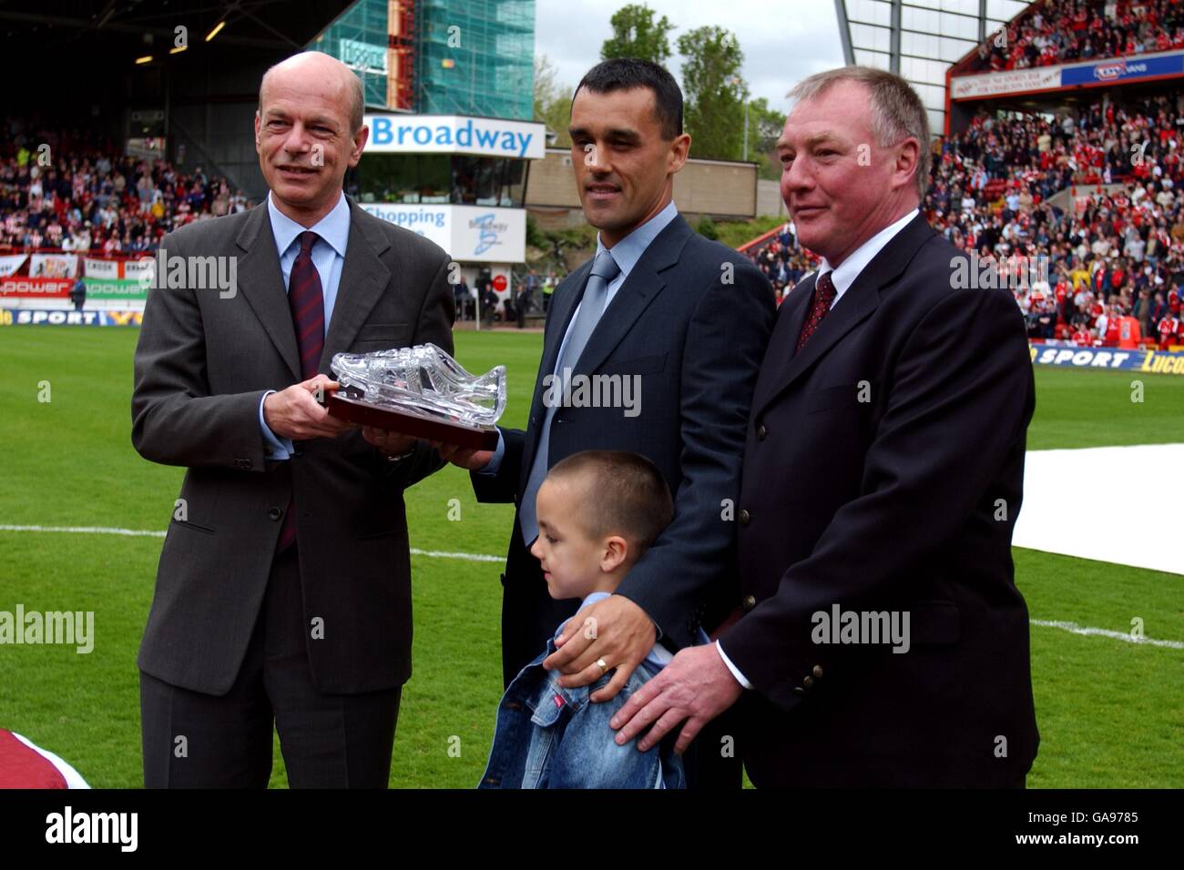 Clive Mendonca is presented with a trophy to acknowledge his ...