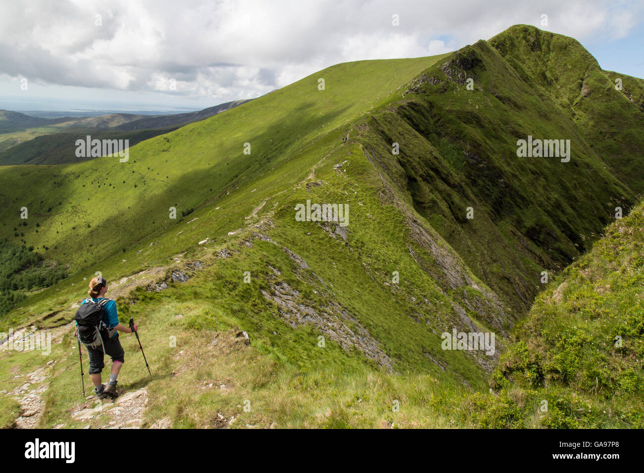A solo female walker on the Nantle Ridge in the Snowdonia National Park ...