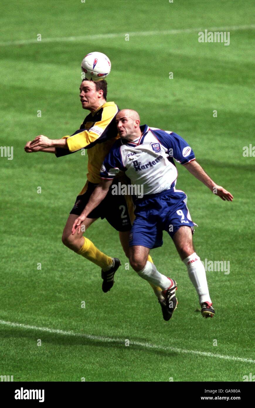 Cheltenham towns michael duff jumps with rushdens scott partridge hi ...