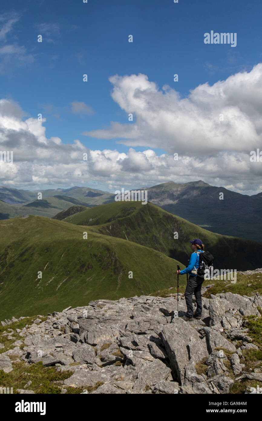 Solo female hiker looking back over the Nantle Ridge in the Snowdonia ...
