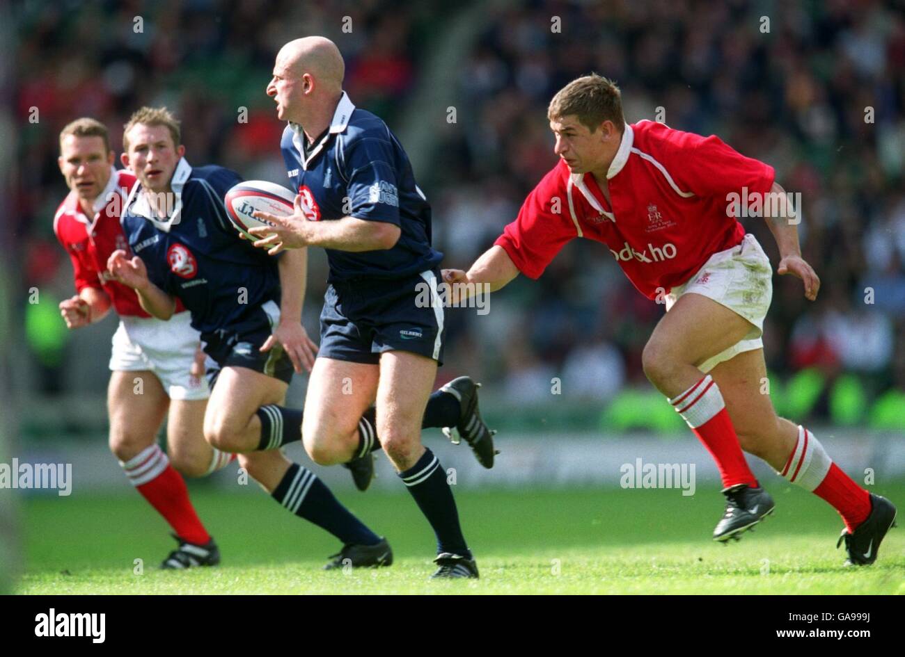 The Navy's Jamie Phillips (l) gets away from the Army's Andy Dawling (r ...