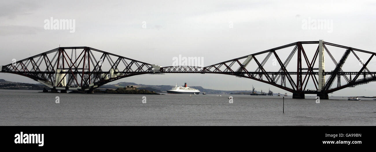 Famous ship docks beside landmark bridge Stock Photo - Alamy