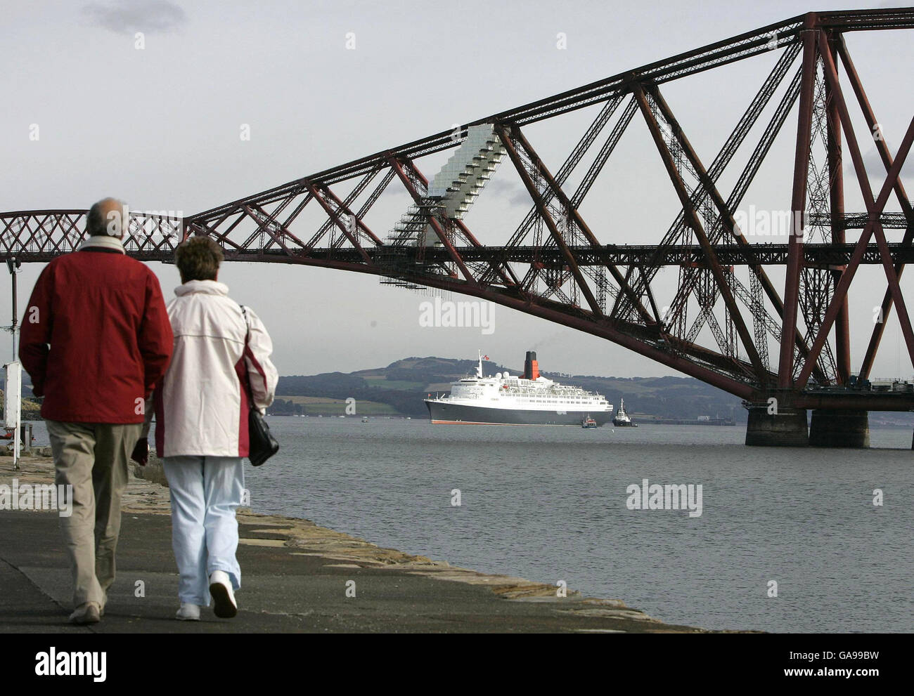 Famous ship docks beside landmark bridge Stock Photo - Alamy