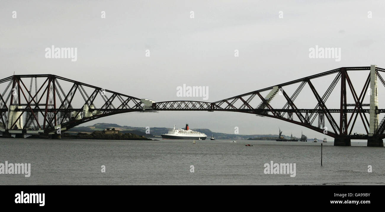Famous ship docks beside landmark bridge Stock Photo - Alamy