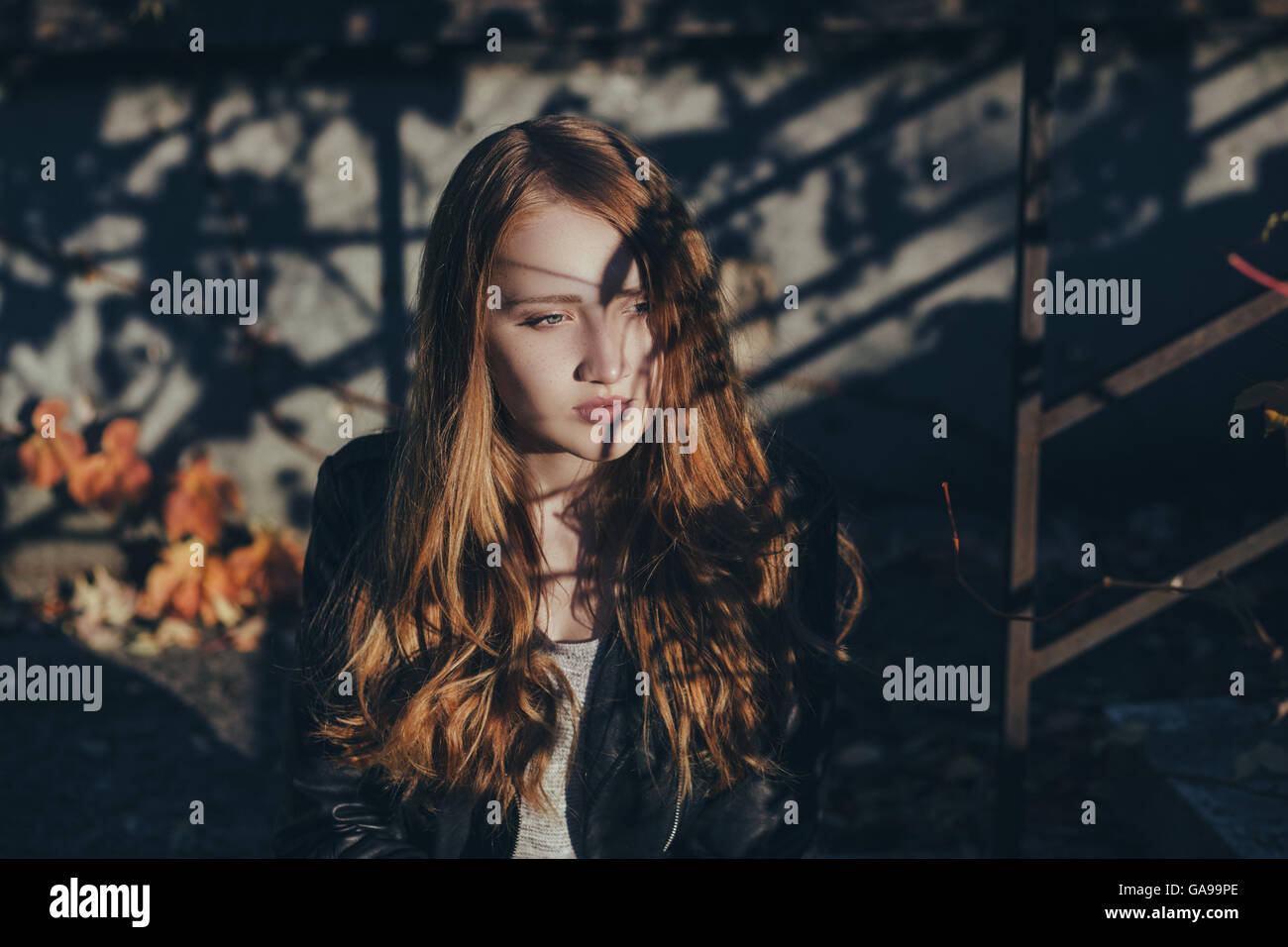 Portrait of a redhead girl in shadow Stock Photo - Alamy