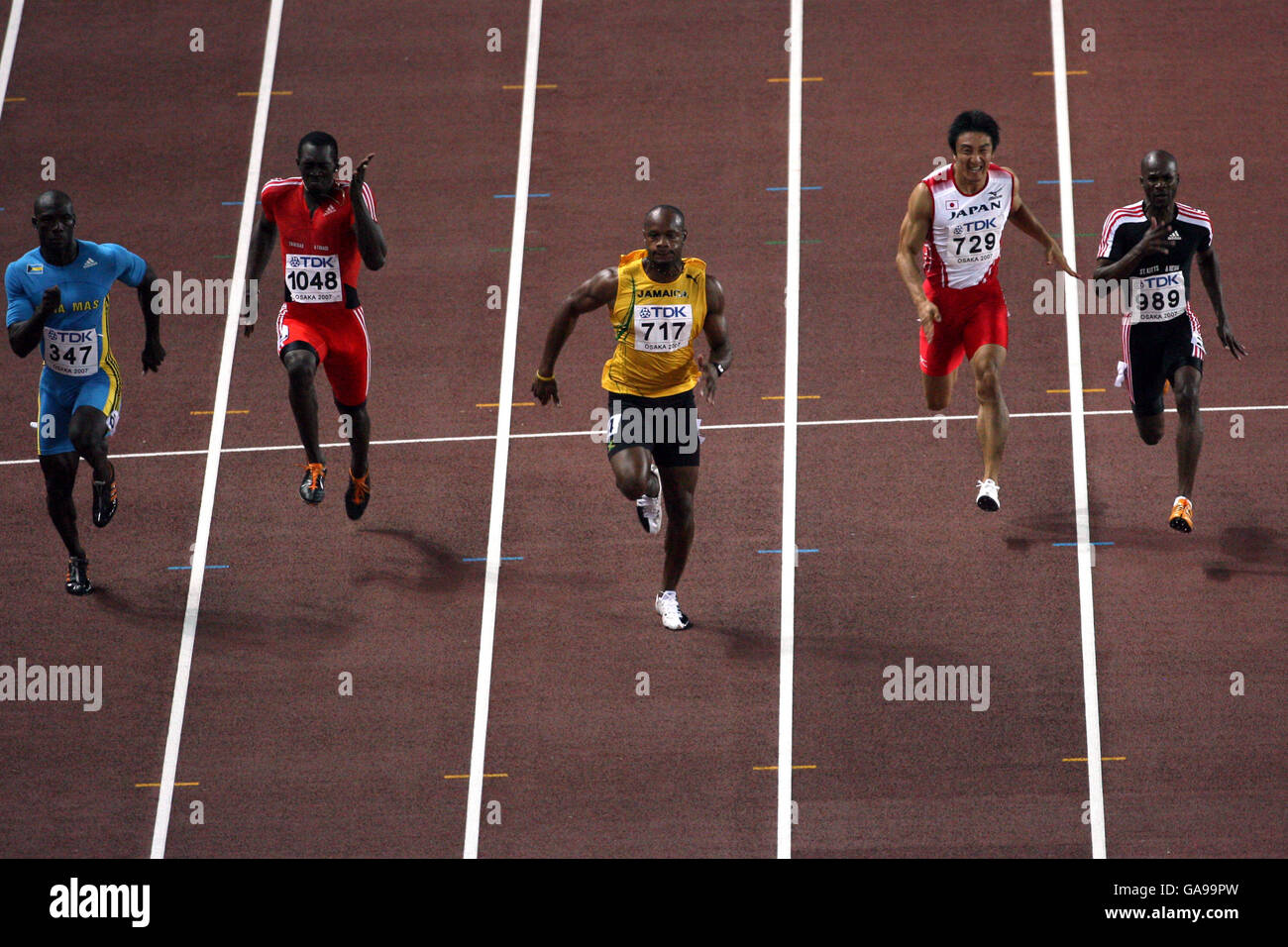 Bahamas' Derrick Atkins (l) and Jamaica's Asafa Powell (c) in action ...