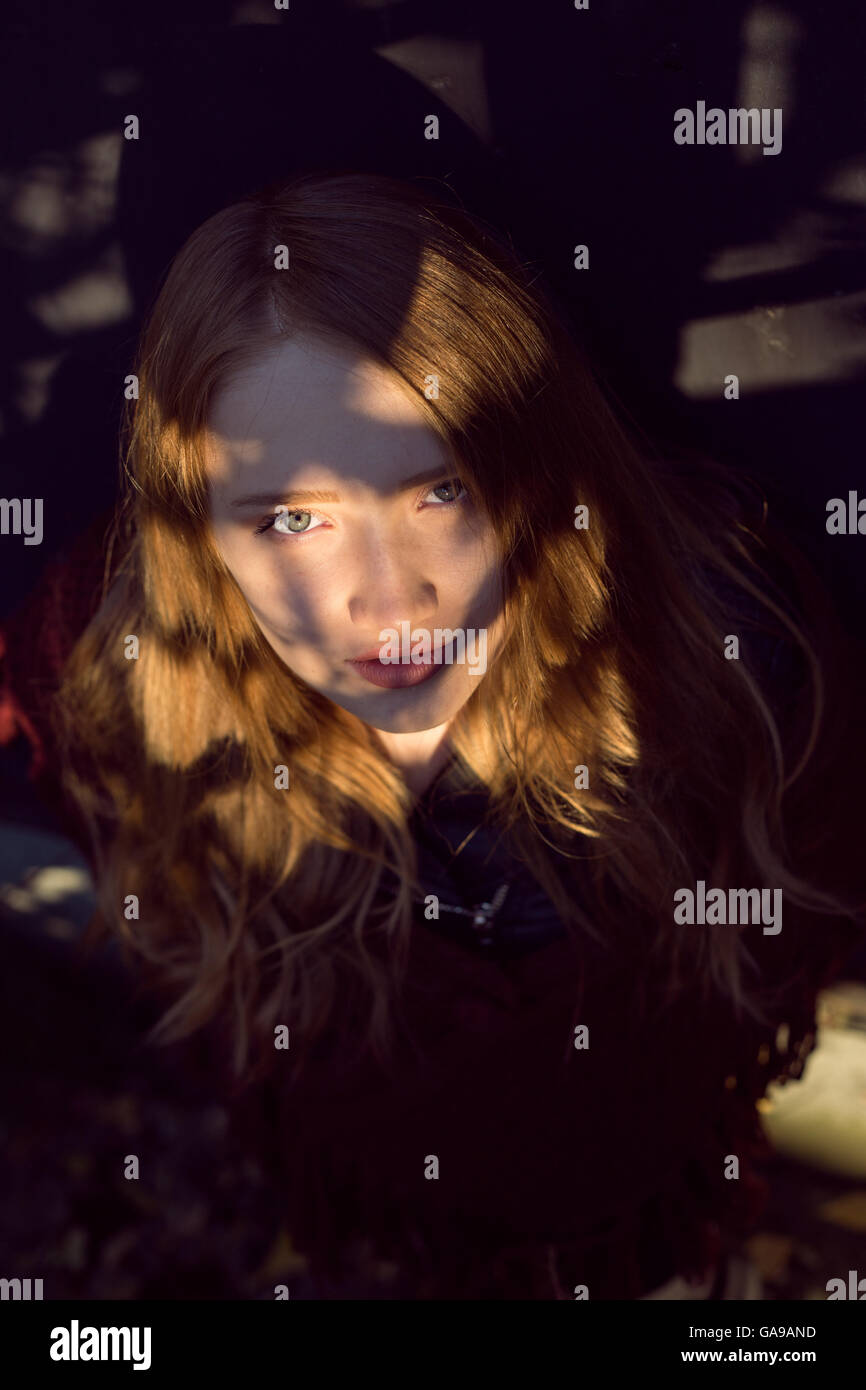 Portrait of a redhead girl in shadow Stock Photo - Alamy