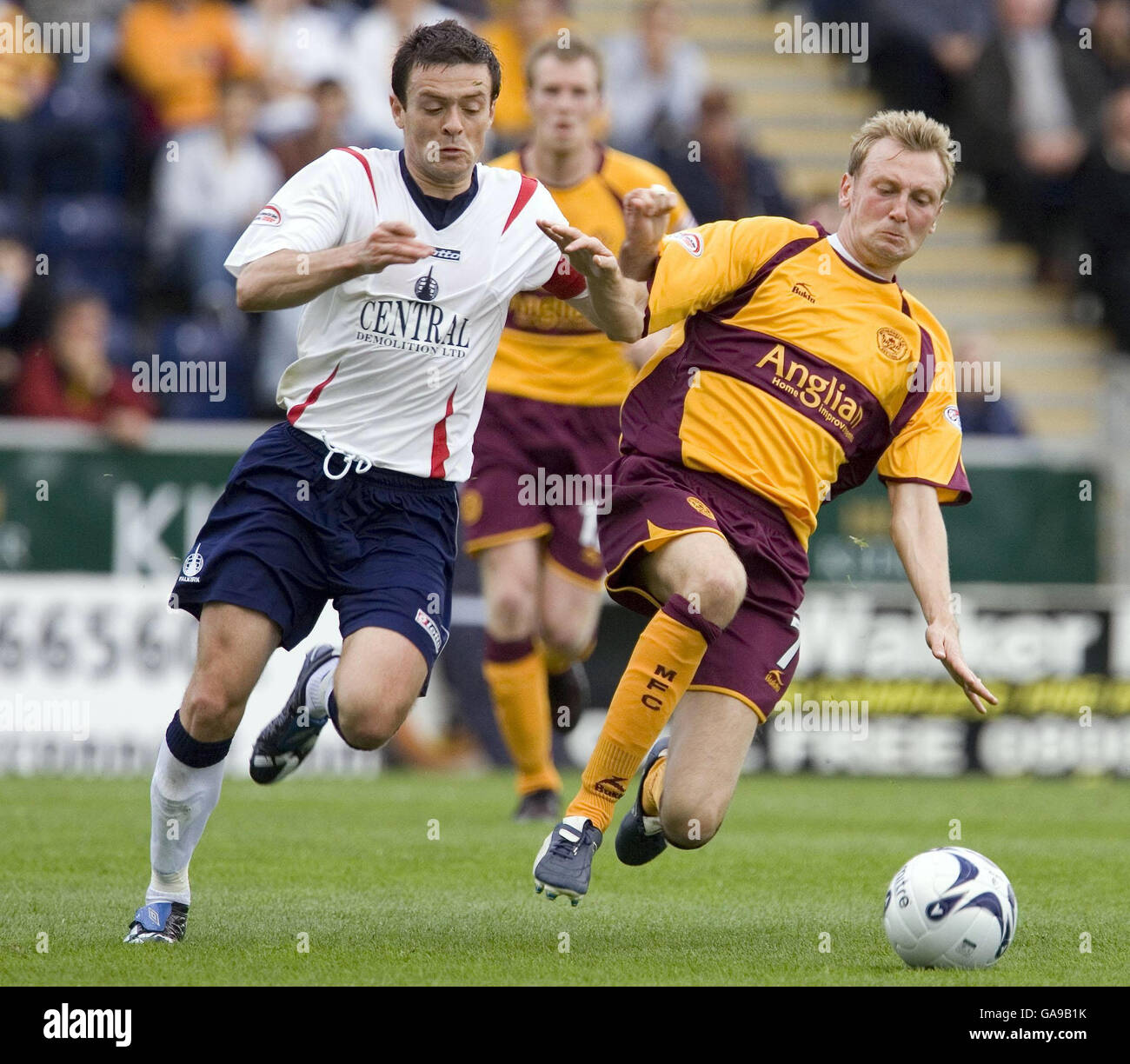 Falkirk's Steven Thomson (left) battles with Motherwell's Stephen ...
