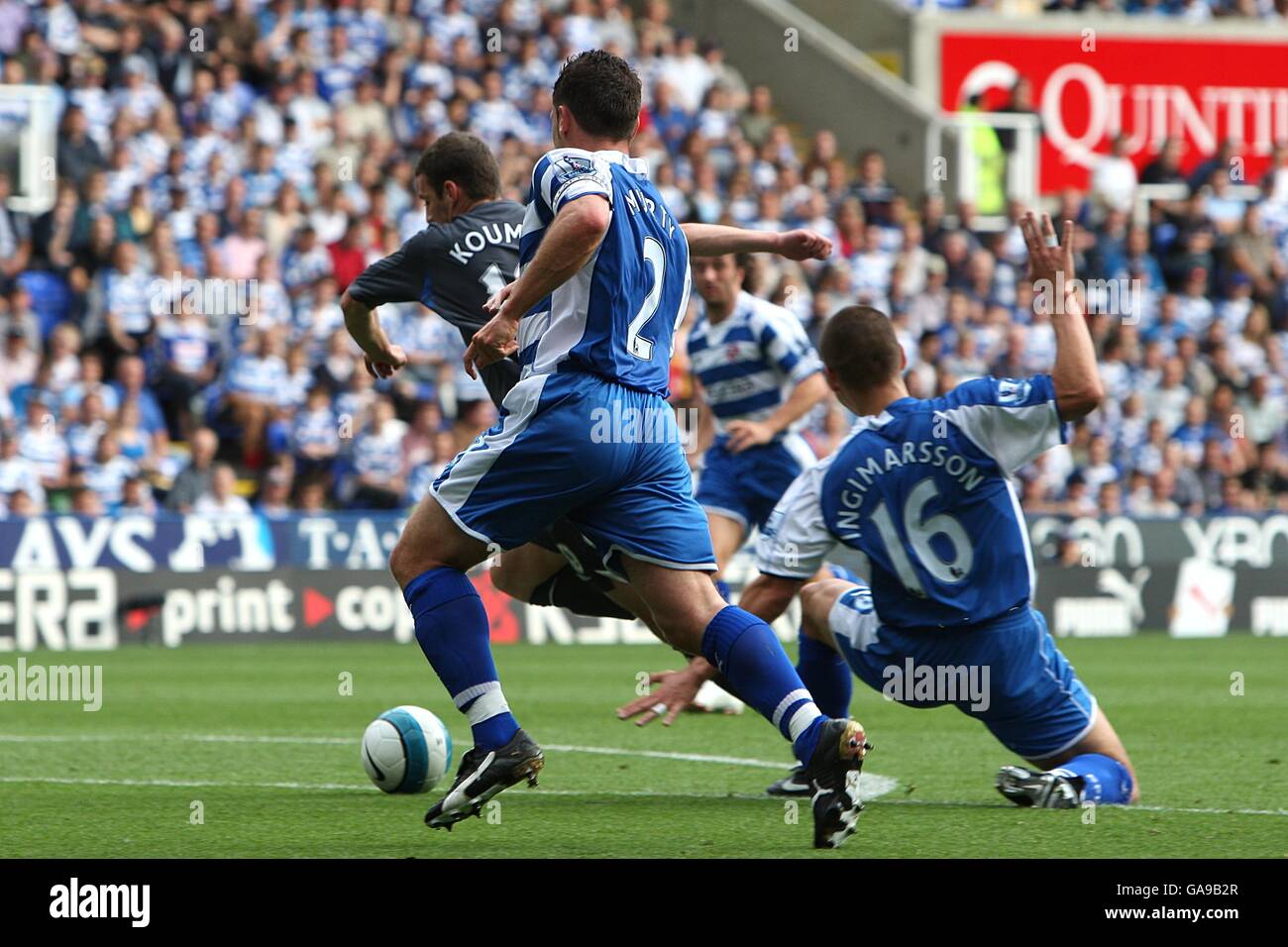 Wigan Athletic's Jason Koumas is fouled by Reading's Ivar Ingimarsson ...