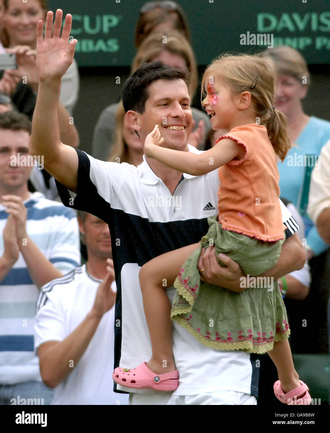 Great Britain's Tim Henman and his daughter Rosie wave goodbye during ...