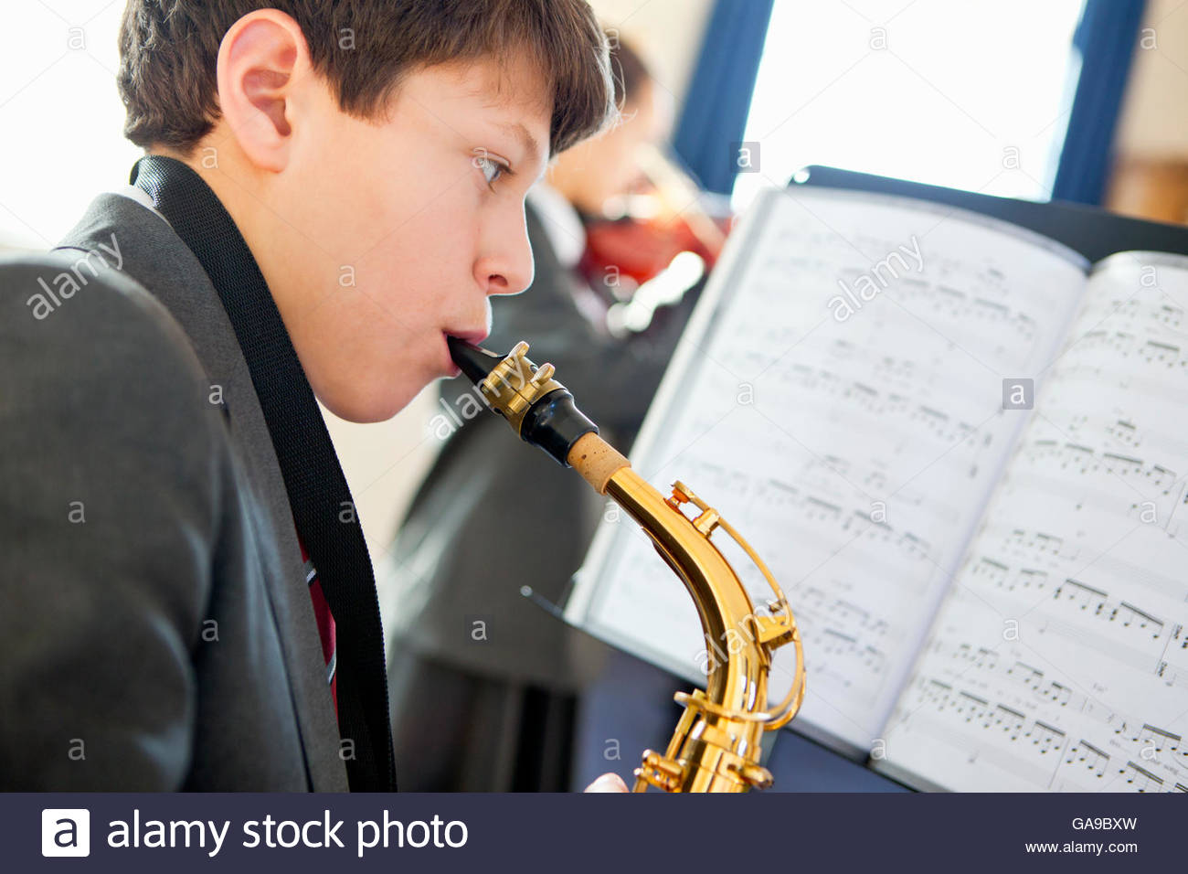 Boy Playing Saxophone Stock Photos & Boy Playing Saxophone Stock Images ...