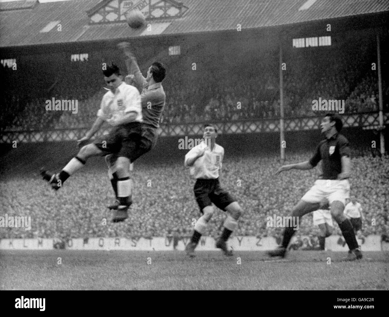 Portugal goalkeeper ernesto punches clear from englands stan pearson hi ...