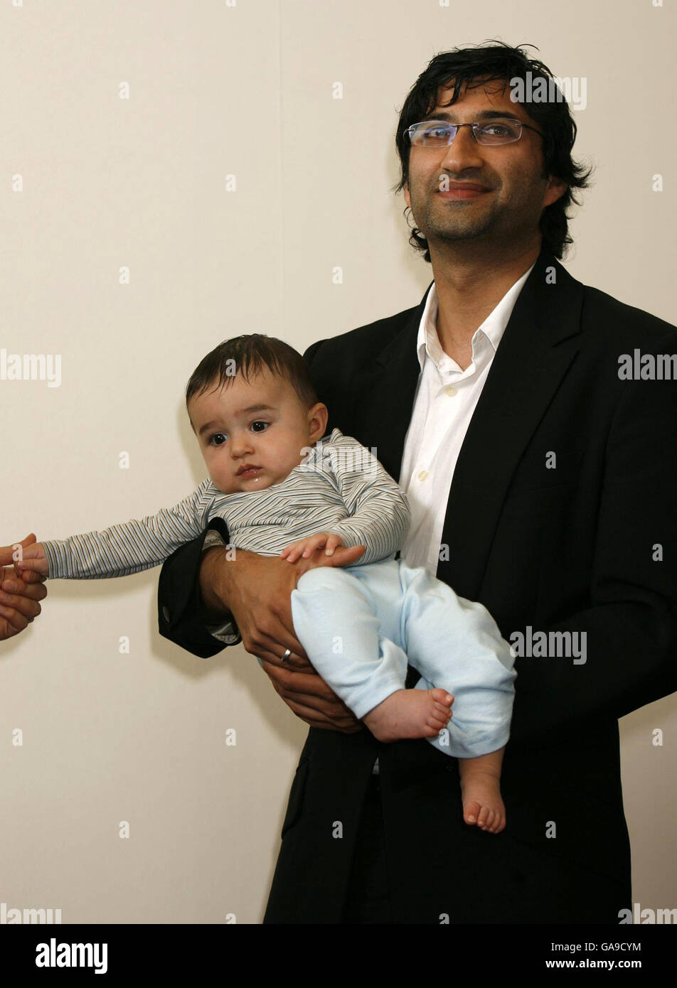 AP OUT Director Asif Kapadia and his baby son, attend the photocall for ...