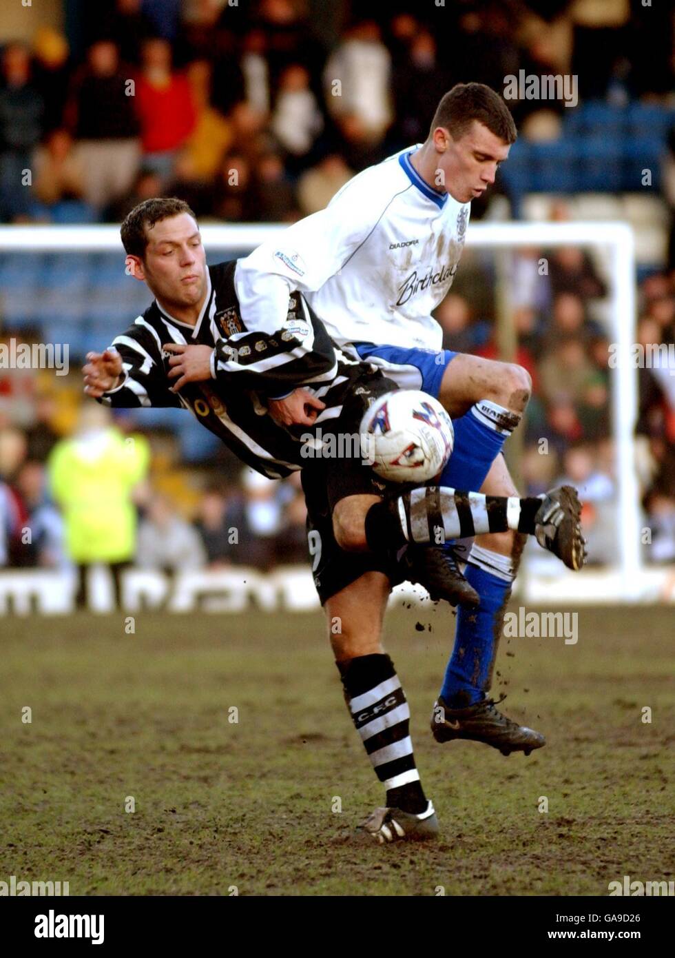 Leam Richardson of Notts County and Jon Newby of Bury battle for the ...