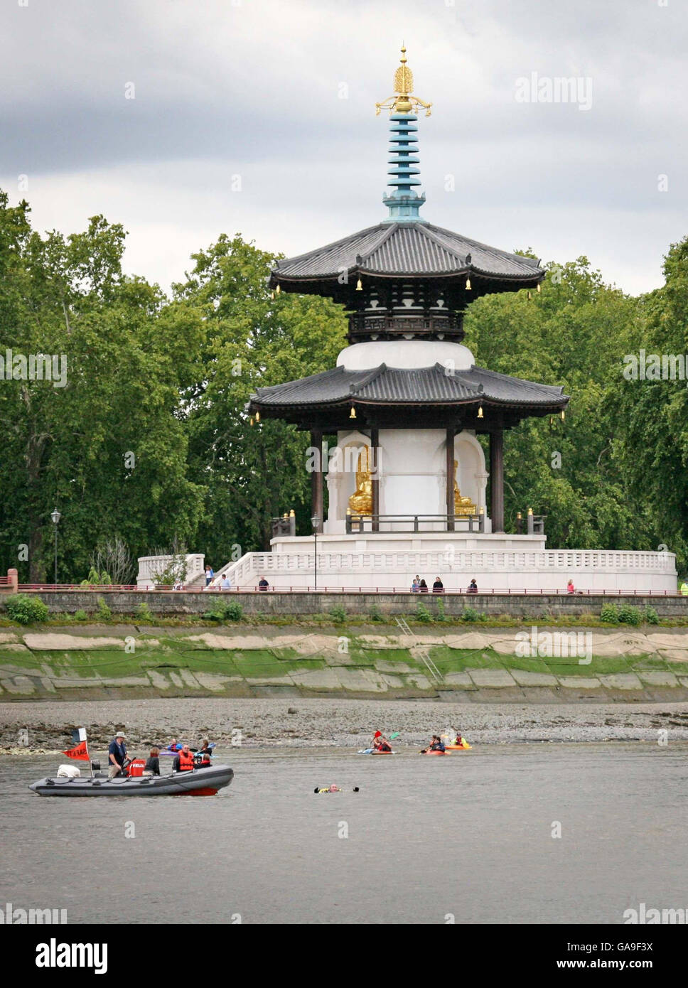 Graham Boanas, 44, from Hull (bottom, centre) crosses the River Thames ...