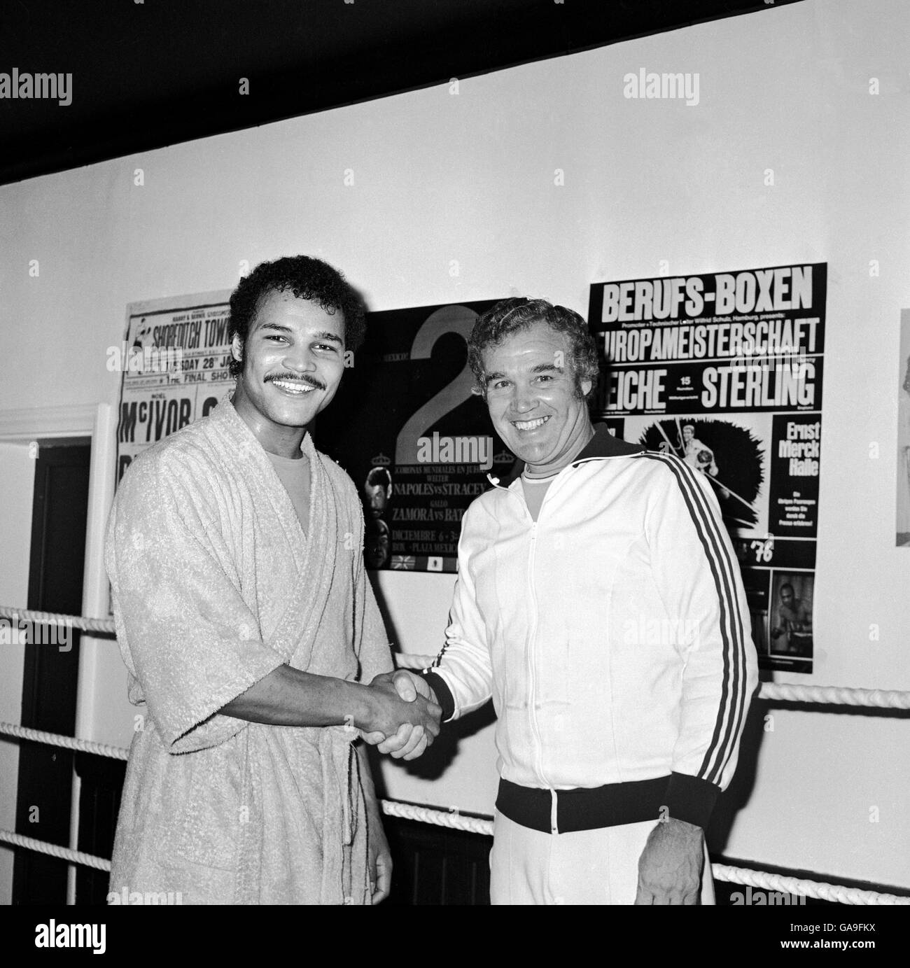 (L-R) World light-heavyweight champion John Conteh shakes hands with ...