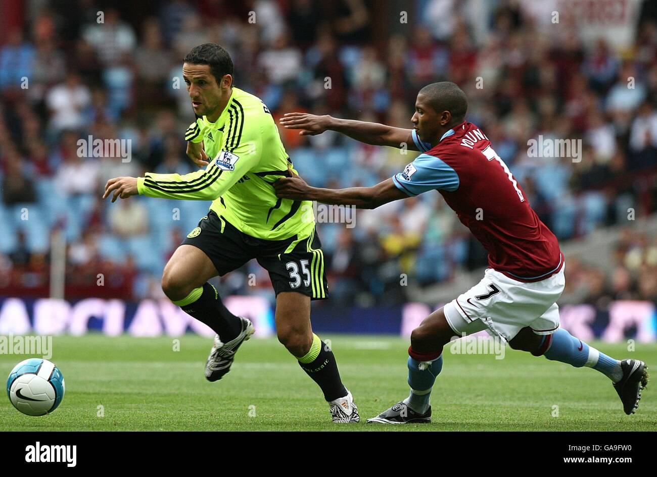 Ashley Young, Aston Villa (r) and Juliano Belletti, Chelsea battle for ...