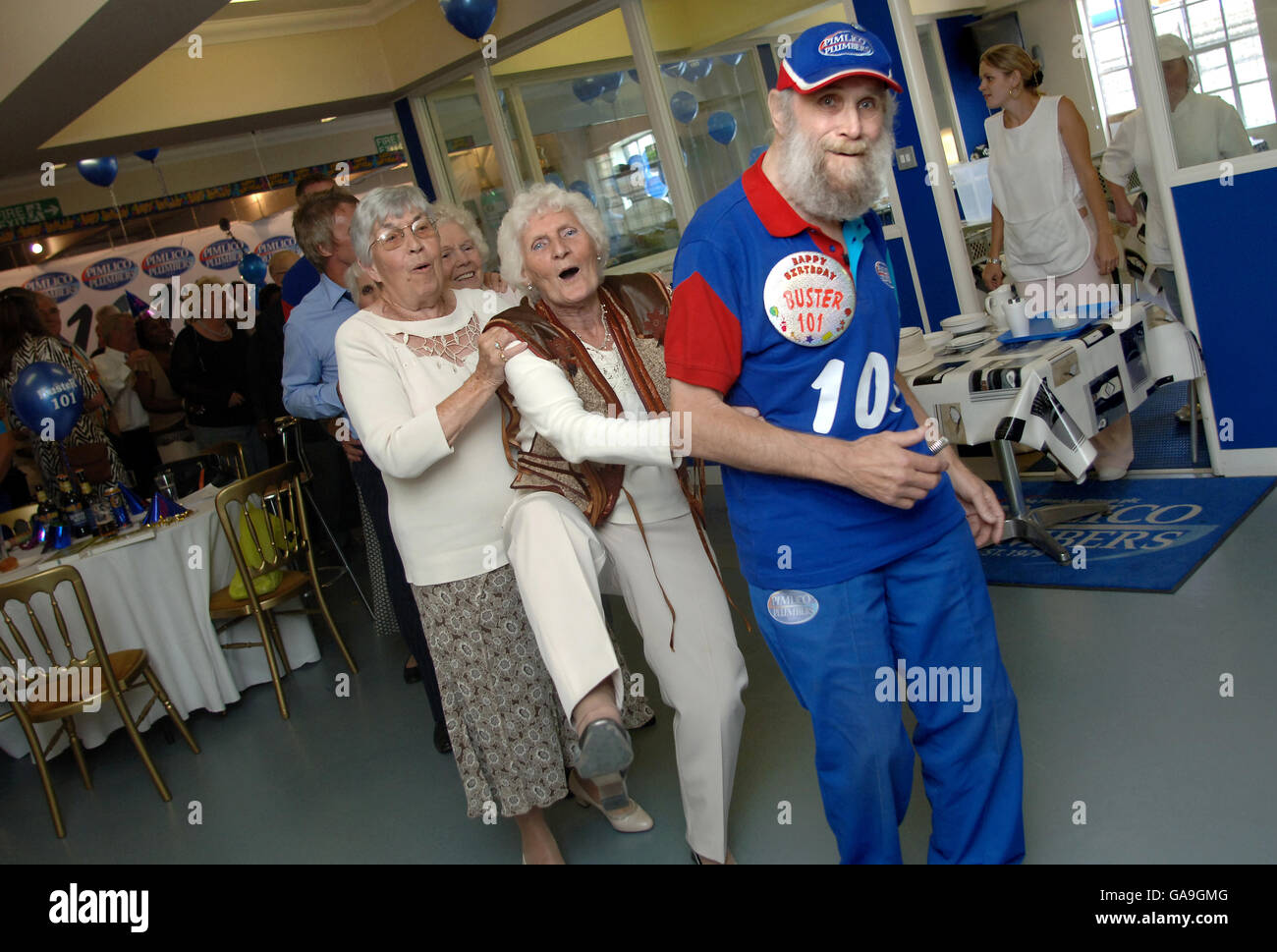 Working plumber Buster Martin (right) leads a conga dance as he ...