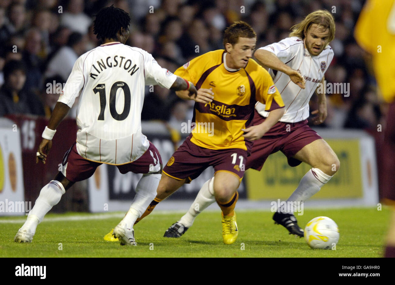 Hearts' Laryea Kingston (left) and Robbie Neilson tussle with ...
