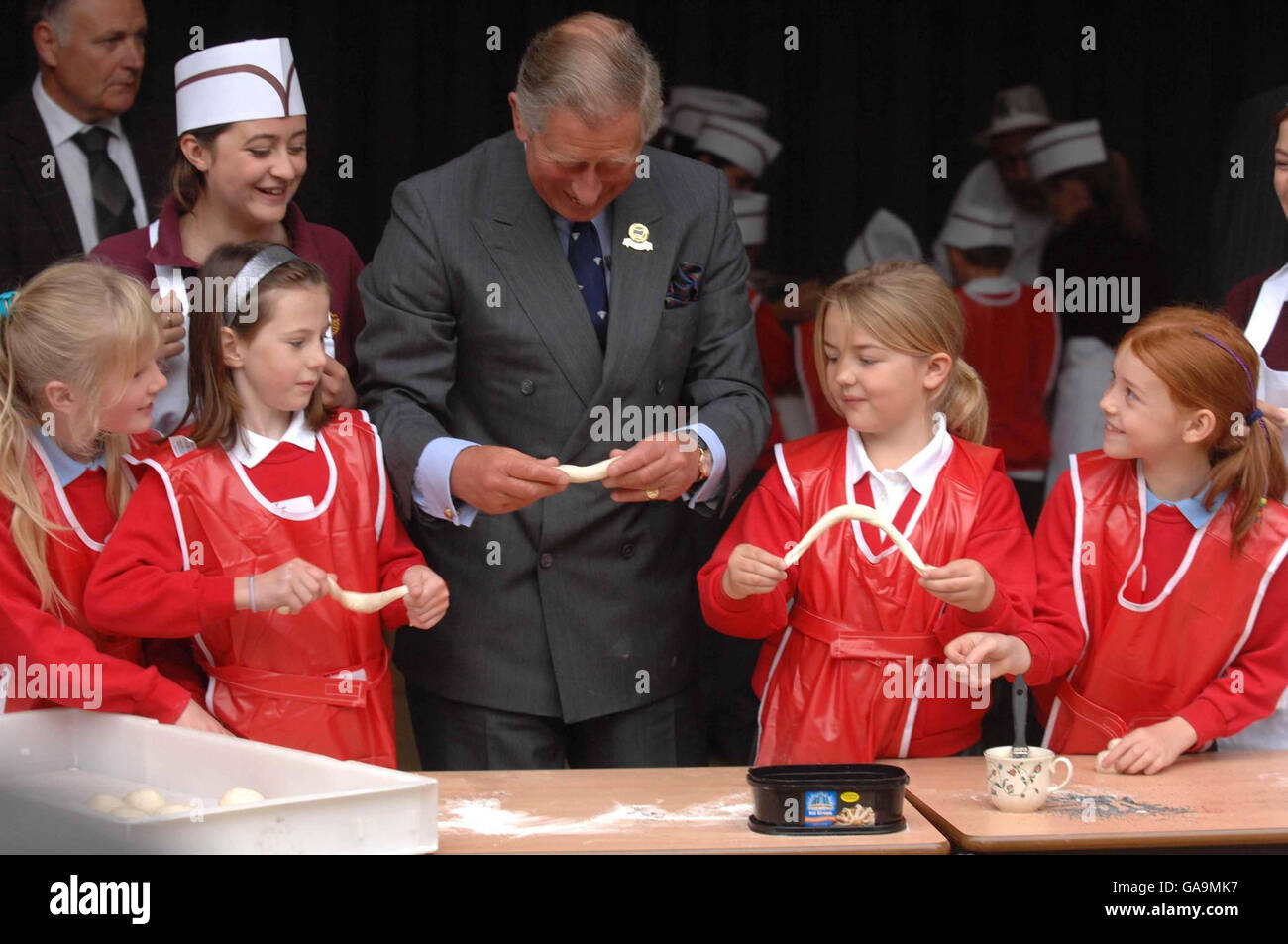 The Prince of Wales helps make bread with children at Avening Primary ...