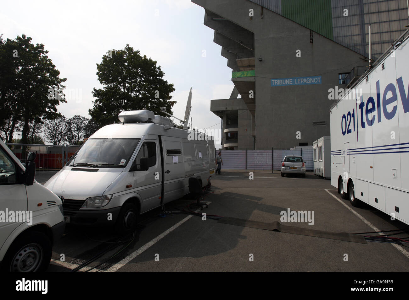 TV broadcast vehicles. SIS Link vans outside the Stade Felix Bollaert ...