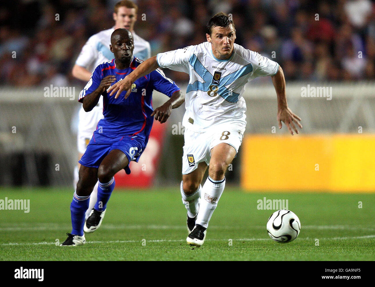 Scotland's Lee McCulloch gets away from France's Claude Makelele (left ...
