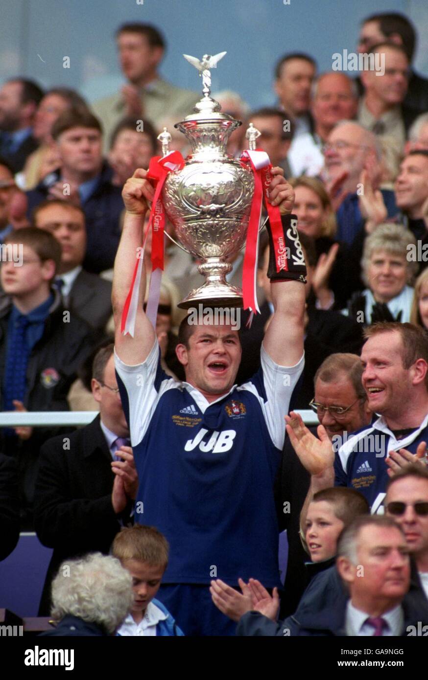 Wigan Warriors' captain Andrew Farrell raises the Kellogg's Nutri Grain ...