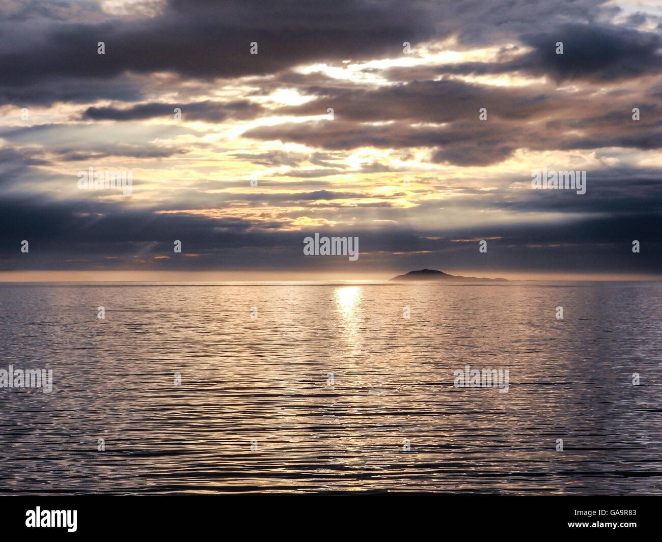 Beautiful sunset over sea with reflections Stock Photo - Alamy