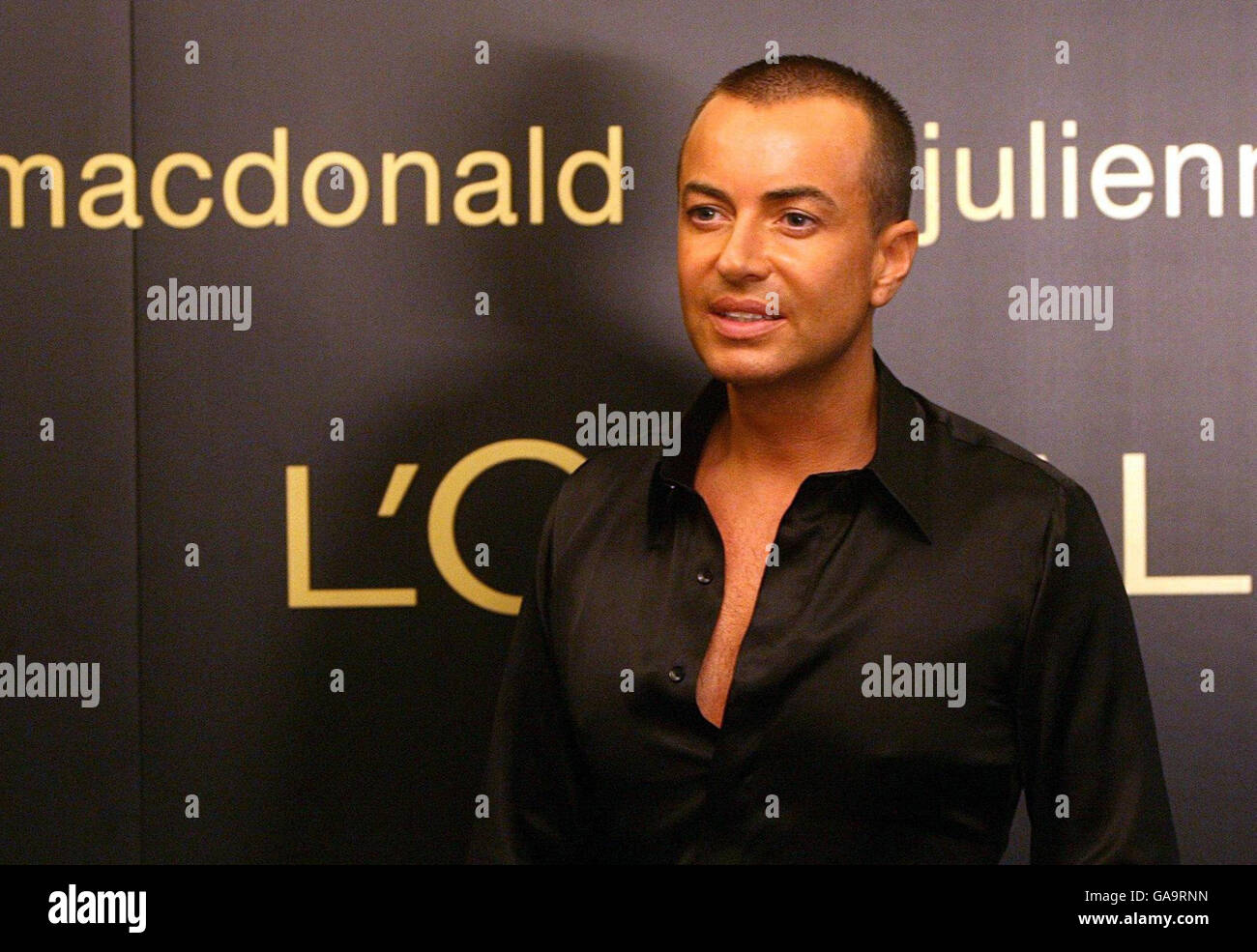 Designer Julien Macdonald backstage prior to his show during London ...