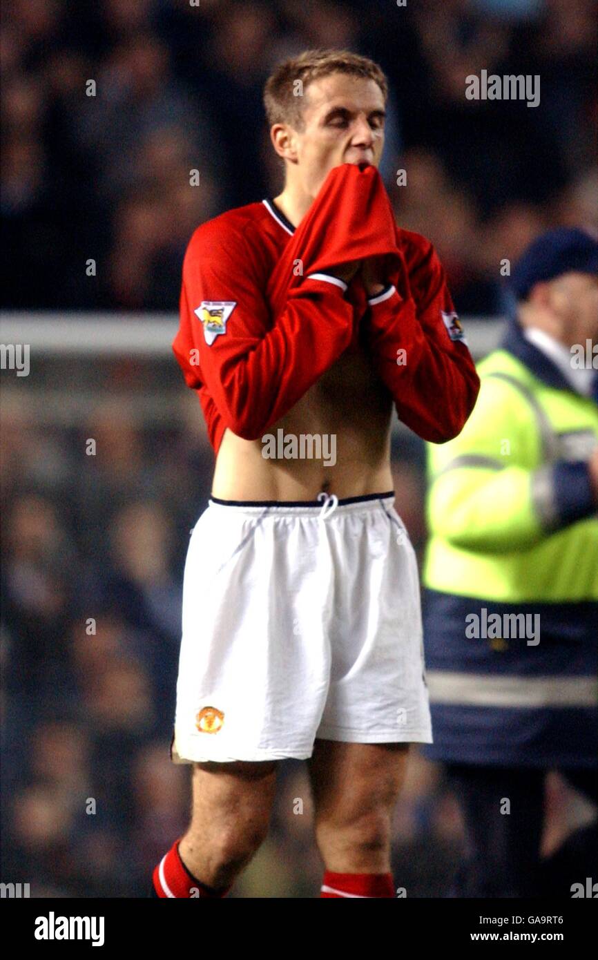 Manchester United's Phil Neville walks from the field after his sides ...