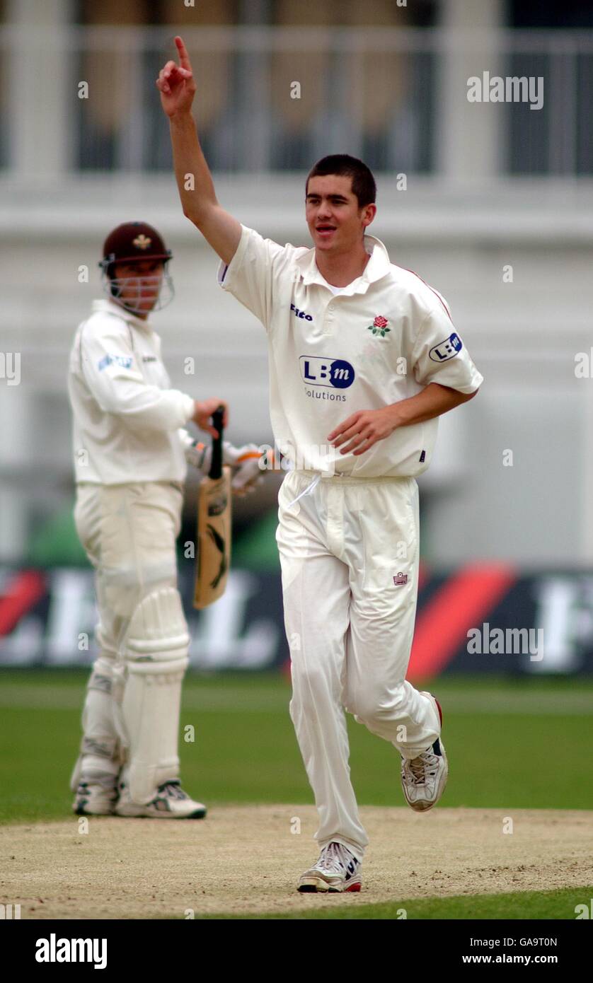 Lancashire's Karl Hogg celebrates the LBW of Surrey's Mark Butcher ...